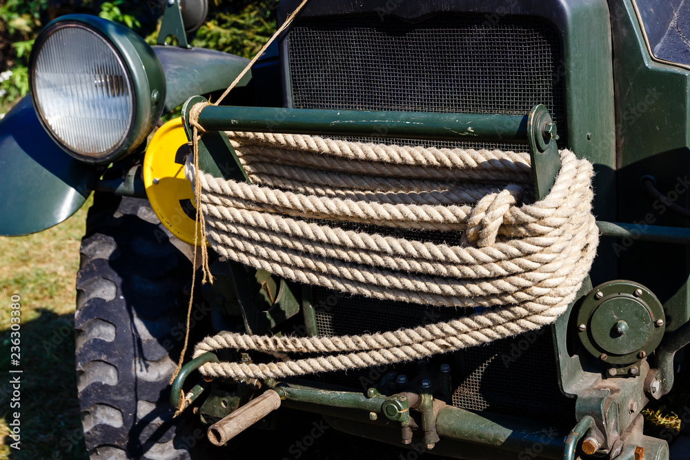 Towing rope is tightly wound on bumper of old military car. Stock Photo ...