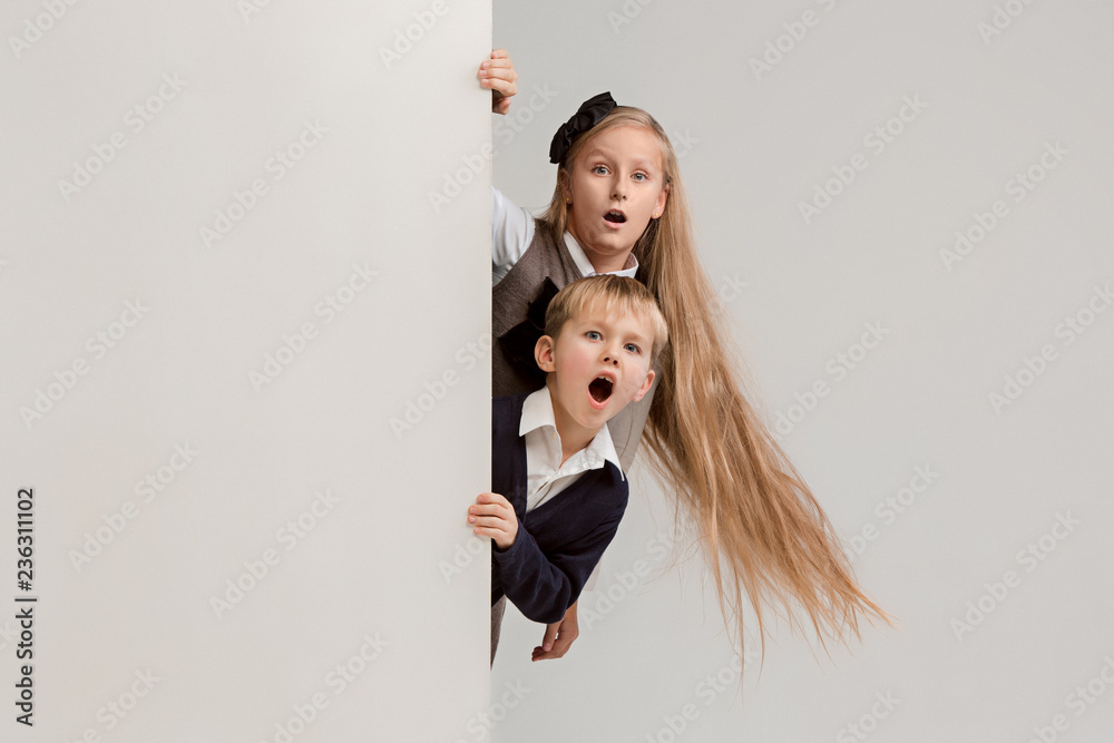 Banner with a surprised children peeking at the edge with copyspace ...