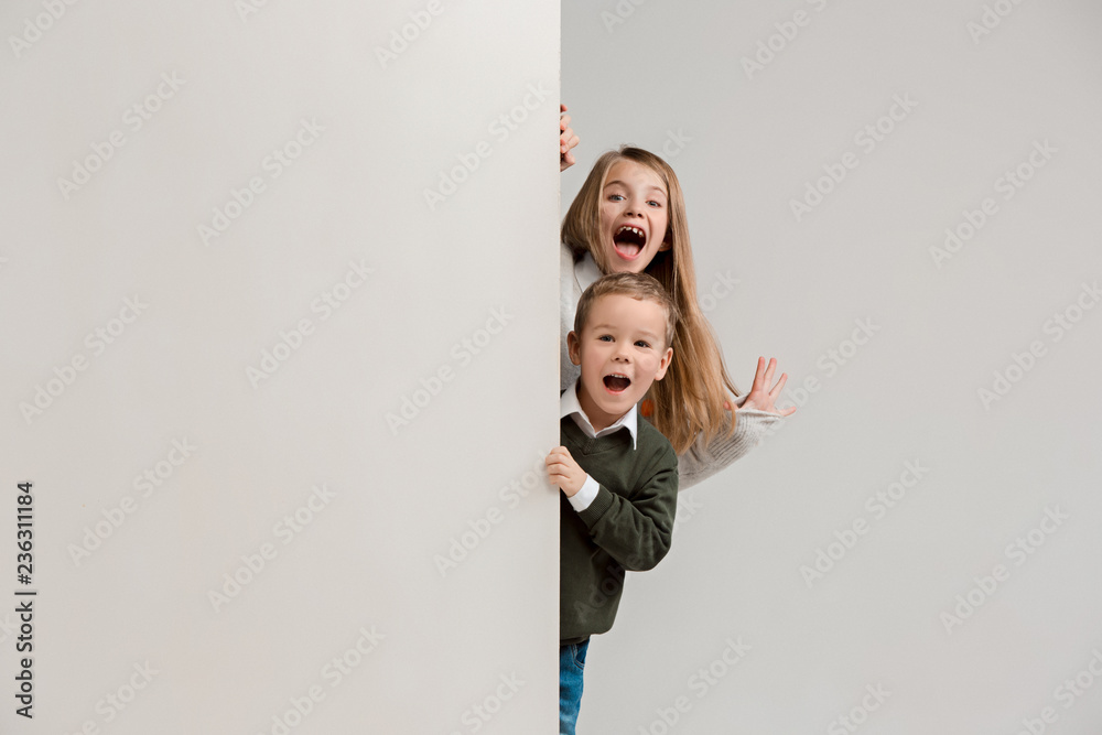 Banner with a surprised children peeking at the edge with copyspace ...