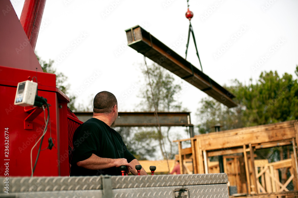 hoisting a steel I-beam with a crane Stock Photo | Adobe Stock