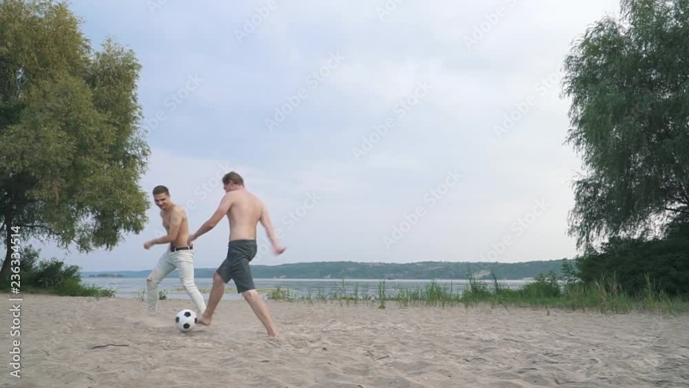 Vidéo Stock Two young guys playing football Competition between people ...