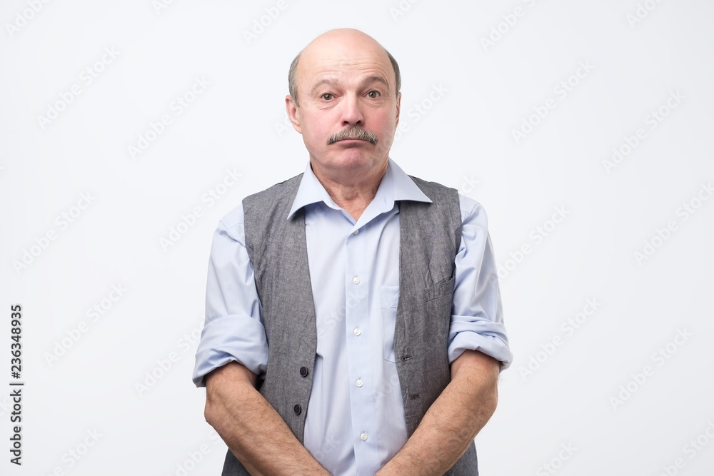Sad upset senior man looking at camera with a little hope. Negative ...