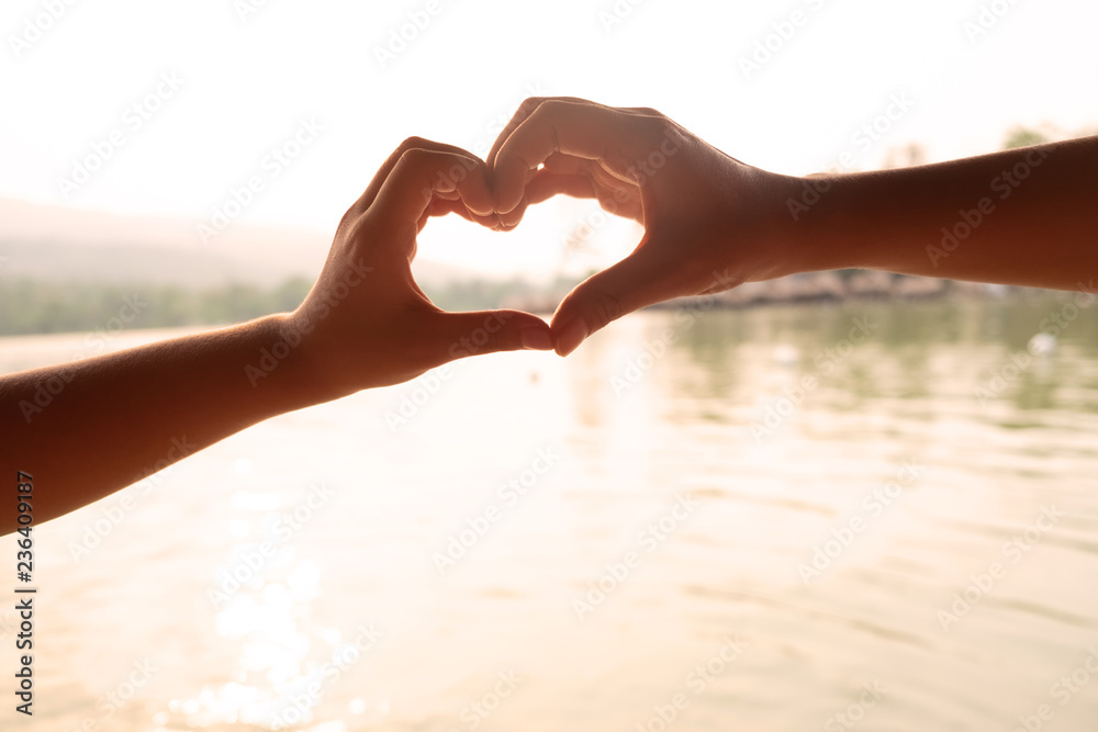Symbol couple hands on sea beach hart symbol with hand in holiday time ...