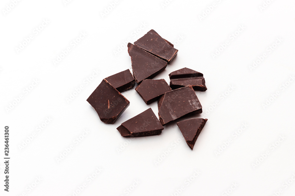 Broken bar of chocolate on a white background. Stock Photo | Adobe Stock