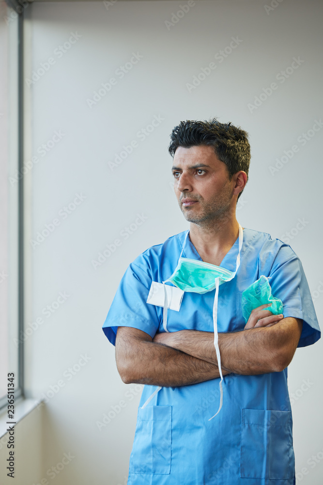 Portrait of middle eastern doctor with operating clothes in a hospital ...
