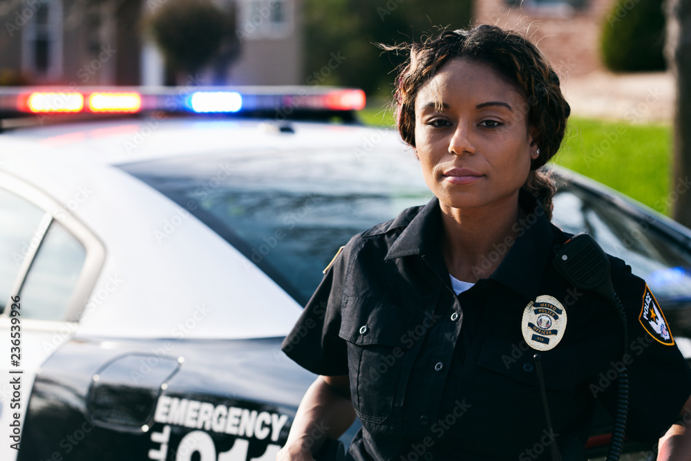 Police: Serious Patrolwoman Stands By Car Looking At Camera Stock Photo ...