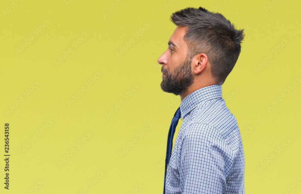 Adult hispanic business man over isolated background looking to side ...