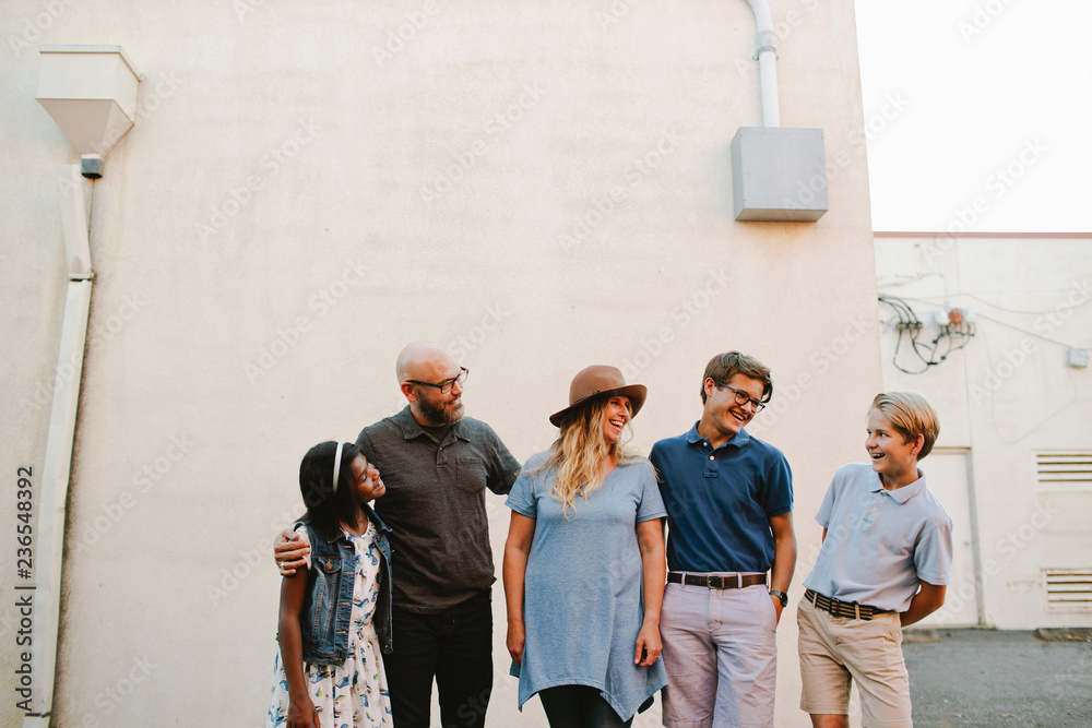 Multi-Race family together in an outdoor, urban setting Stock Photo ...