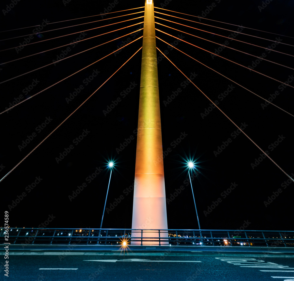 illuminated central pylon of cable suspension bridge Stock Photo ...