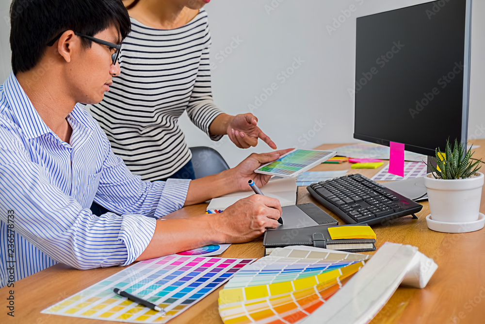 Graphic design with color swatches and tablet on a desk. Graphic ...