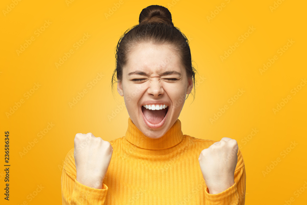 Girl power! Closeup of emotional woman screaming with joy and ...