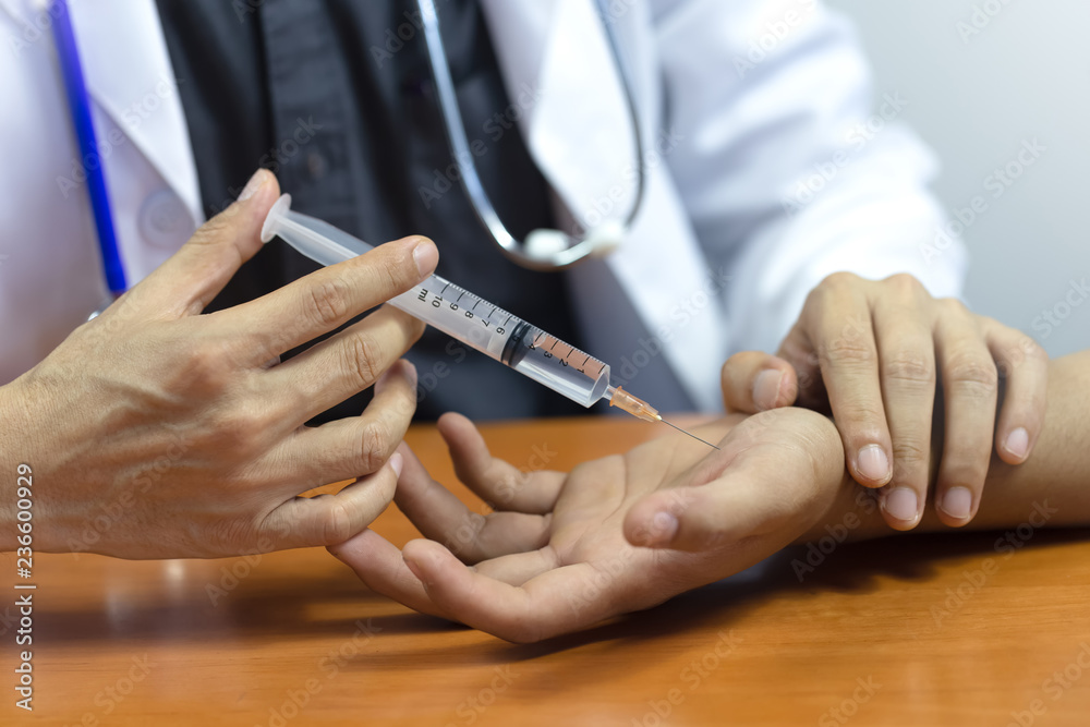 Physiotherapist doing physical therapy of hand man patient massage and ...