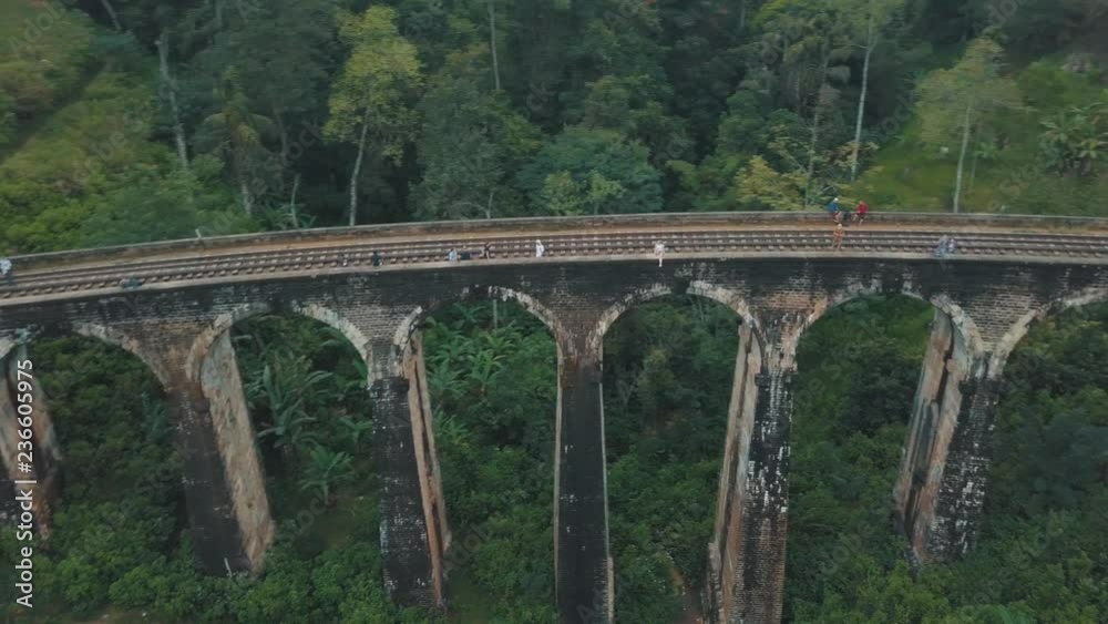 Drone aerial of famous Nine Arches Bridge Sri Lanka railway train with ...