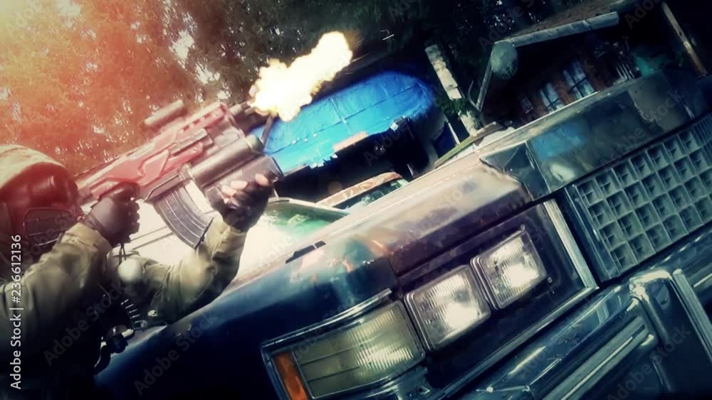 armed soldier getting out of an old rusty car and shooting with a ...
