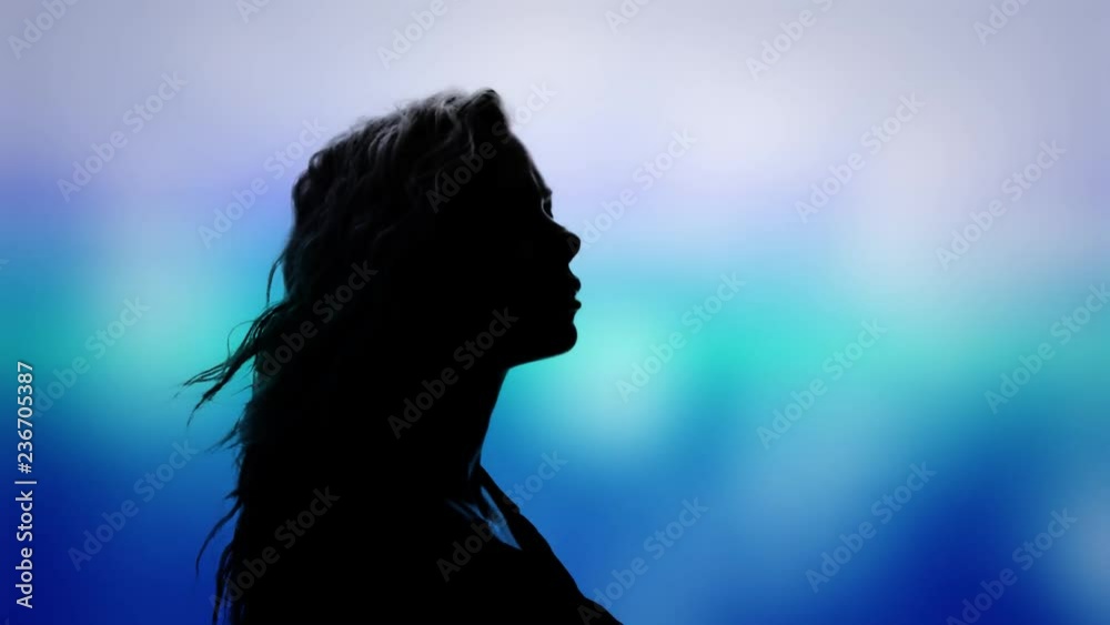 Abstract stylized side view silhouette of a beautiful young woman with ...