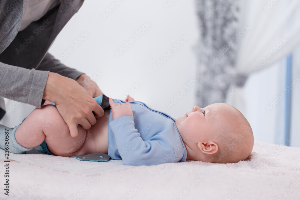 Replacing a dirty diaper with a clean one Stock Photo | Adobe Stock