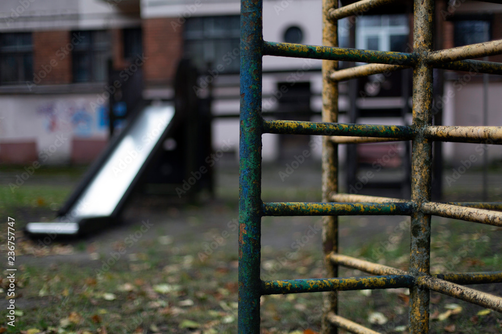 Old sad fall empty playground in the yard Stock Photo | Adobe Stock