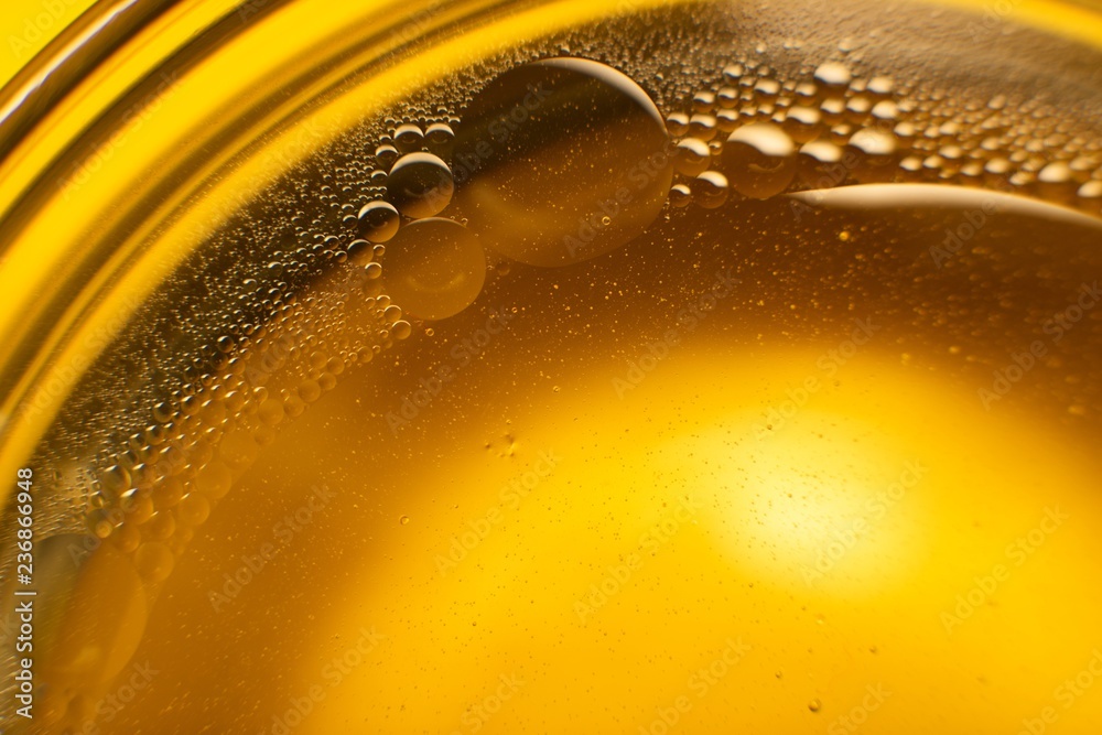 Yellow oil bubbles on water, cooking oil background. Stock Photo ...