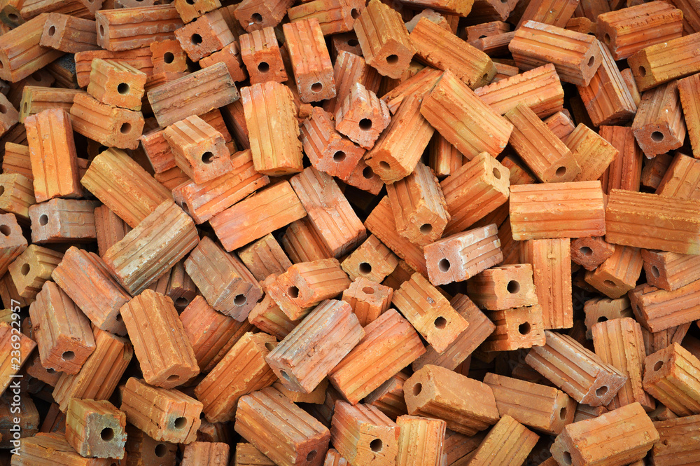 brick texture background / pile of baked clay red brick building ...