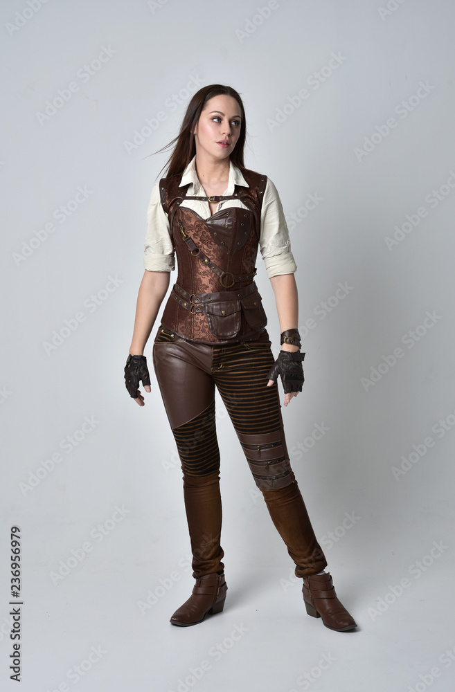 full length portrait of brunette girl wearing brown leather steampunk ...