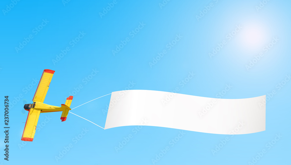 old vintage retro propeller engine airplane flying with white banner ...