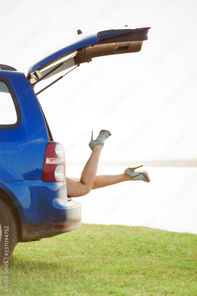female legs with heels sticking out of the trunk Stock Photo | Adobe Stock