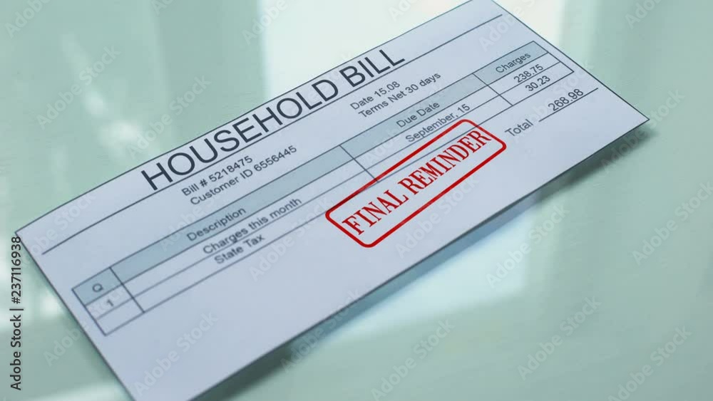 Household bill final reminder, hand stamping seal on document, payment ...
