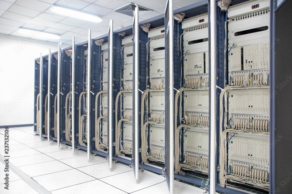 Network server room with Close rack is row in white floor and white ...