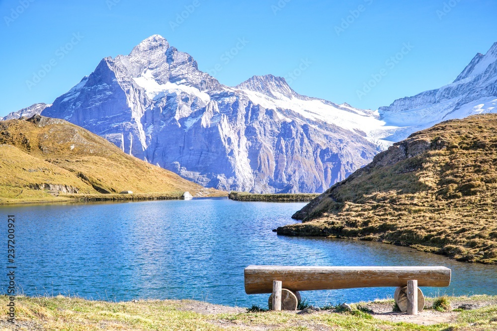 Beautiful Swiss Alps mountain landscape view with empty bench in front ...