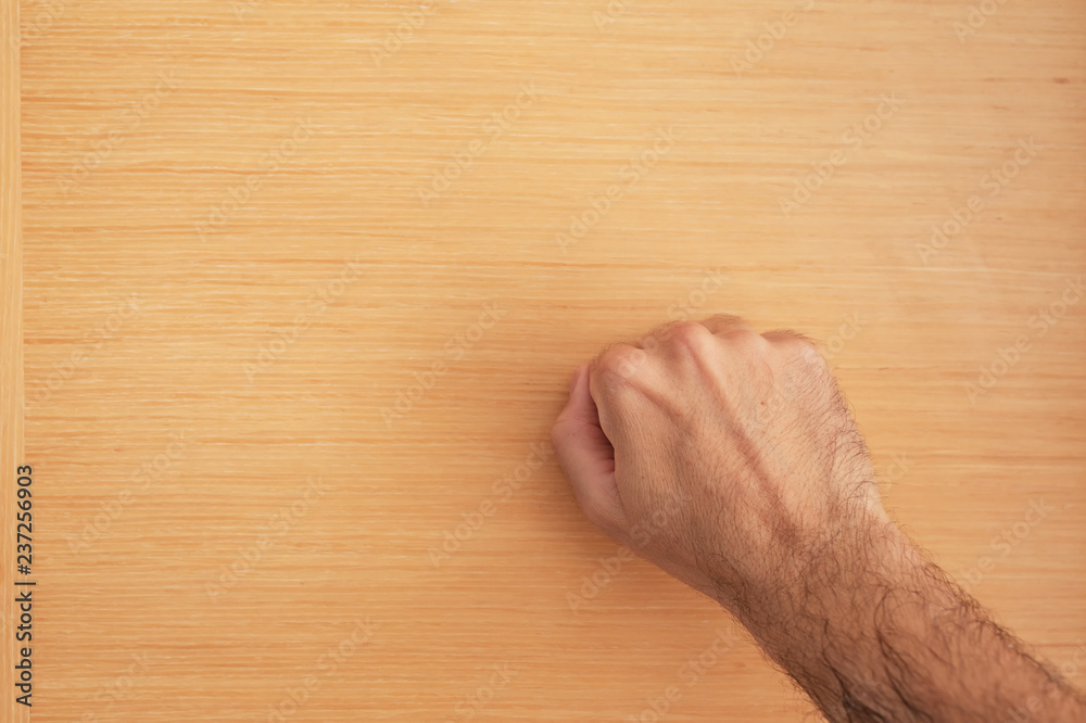 Hand knocking on door Stock Photo | Adobe Stock