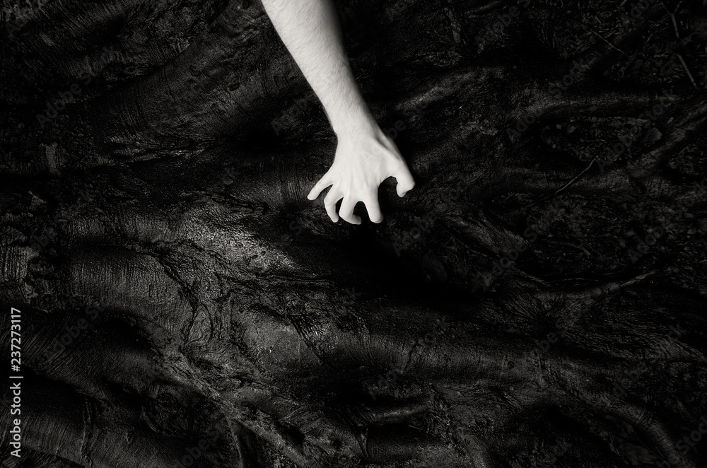Scary hand reaching from underneath on Halloween night Stock Photo ...