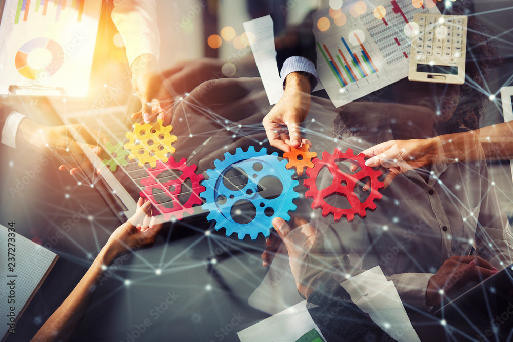 Business team connect pieces of gears. Teamwork, partnership and ...