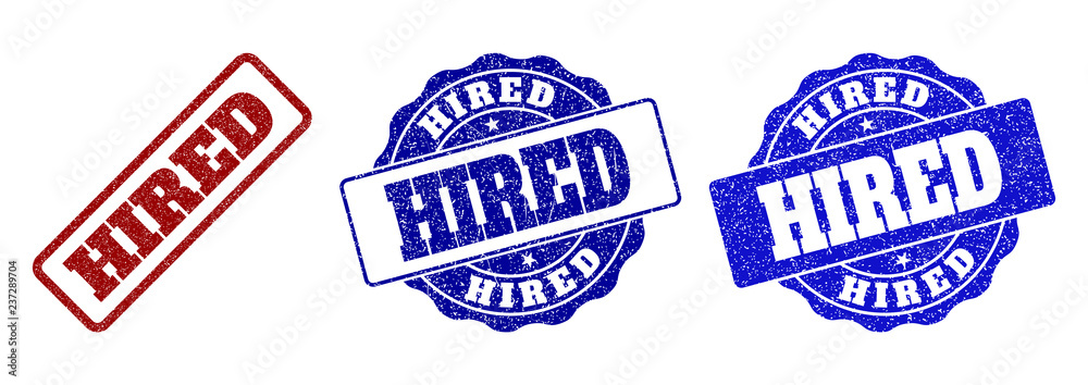 HIRED scratched stamp seals in red and blue colors. Vector HIRED labels ...