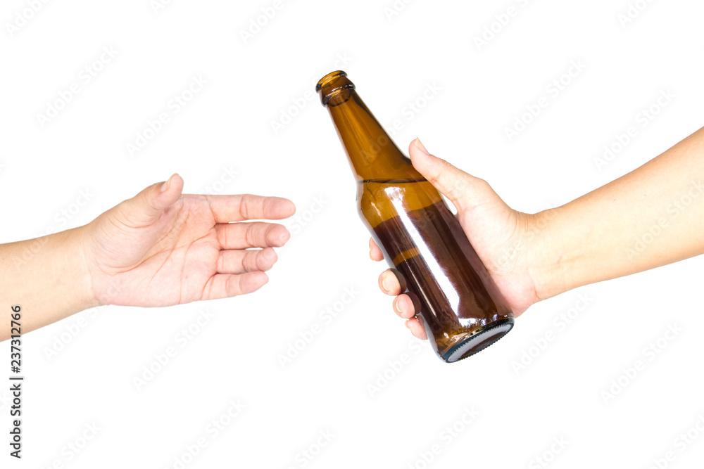 Hand holding a bottle of beer to giving and another hand accept on ...