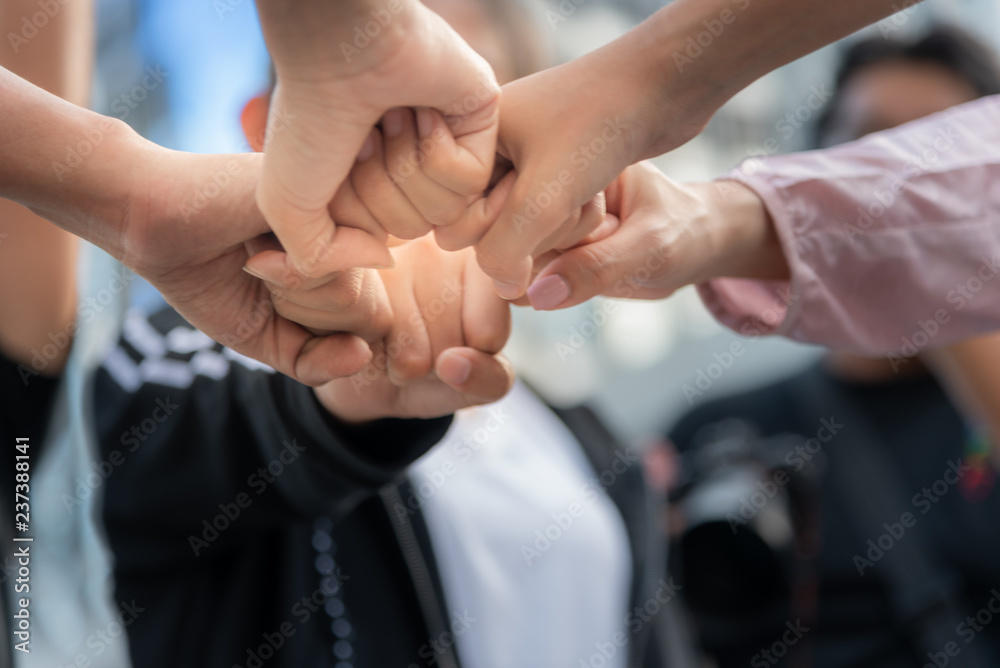People are fist bump to express teamwork, collaboration. to synergy and ...