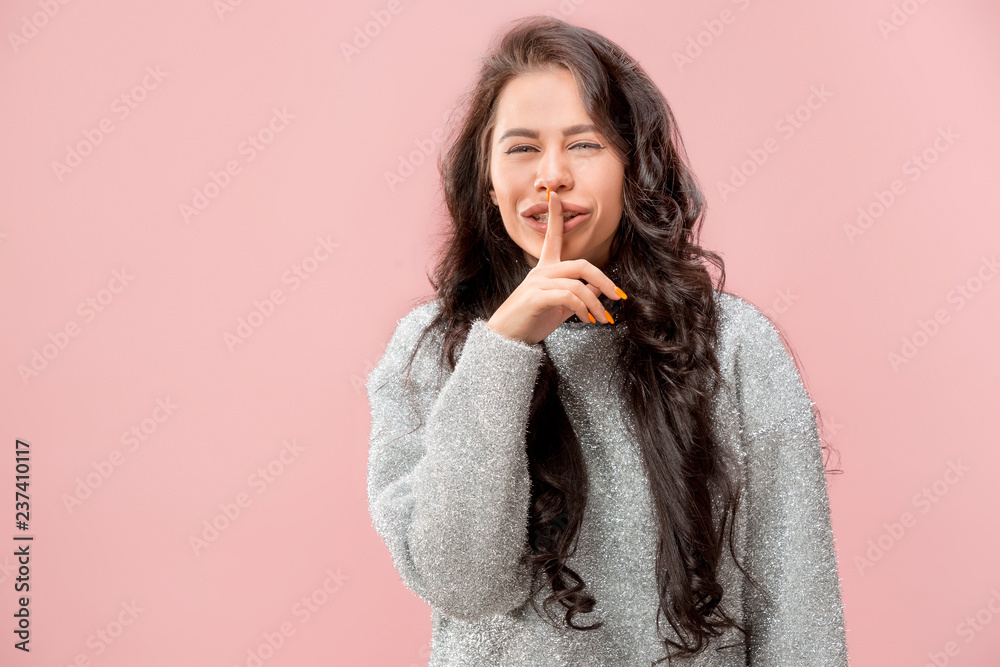 Secret, gossip concept. Young woman whispering a secret behind her hand ...