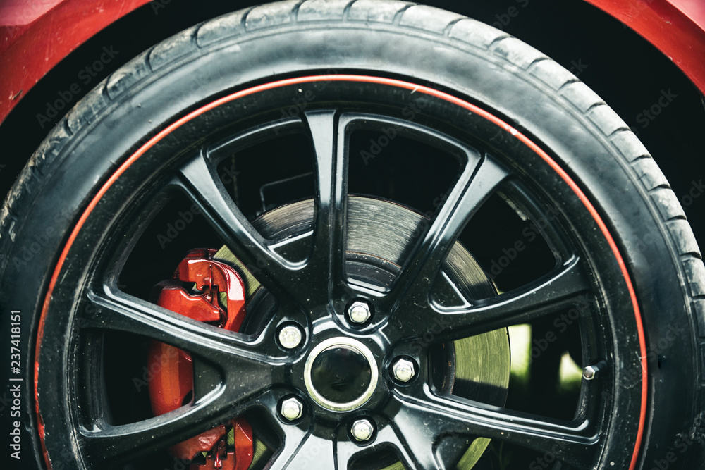 Completed in a high quality gloss. Black rim of luxury car wheel. Car ...