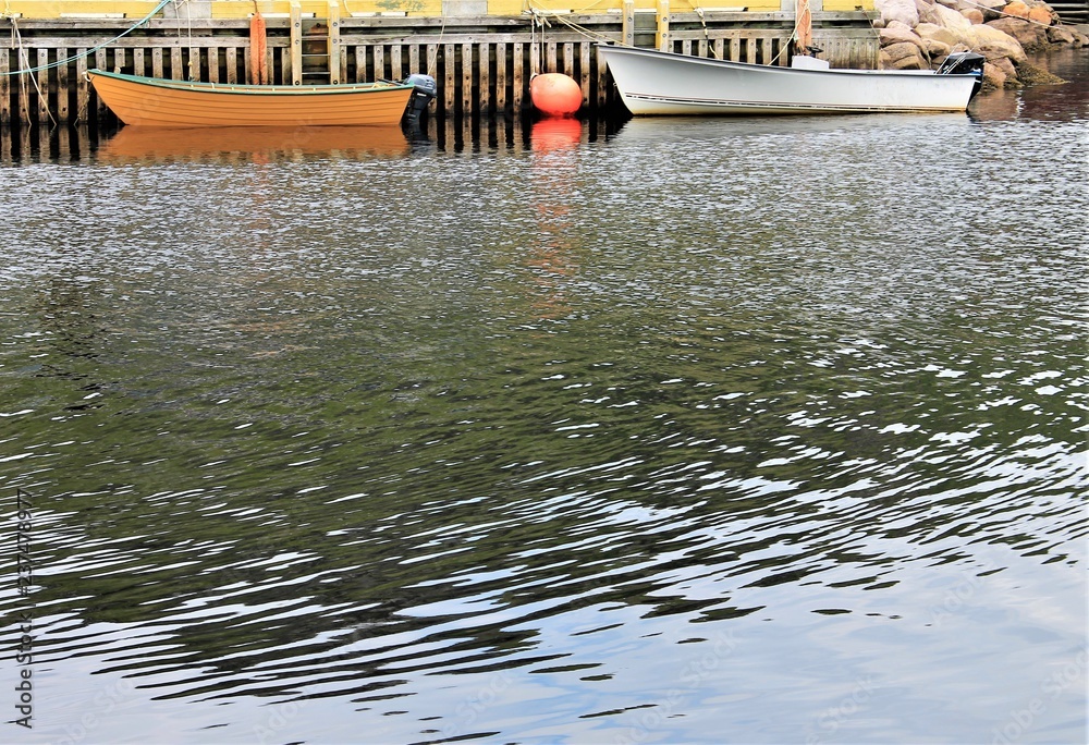 Small boats tied up at the wharf, Petty Harbour, Newfoundland. 2 small ...