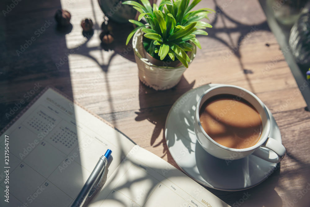 Desktop Calendar 2024 and cup of coffee place on wooden office desk ...