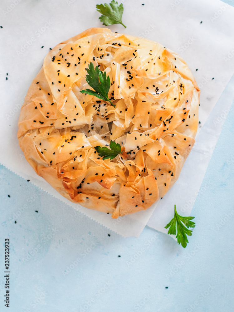 Greek pie spanakopita on blue background. Vegetarian or vegan ...