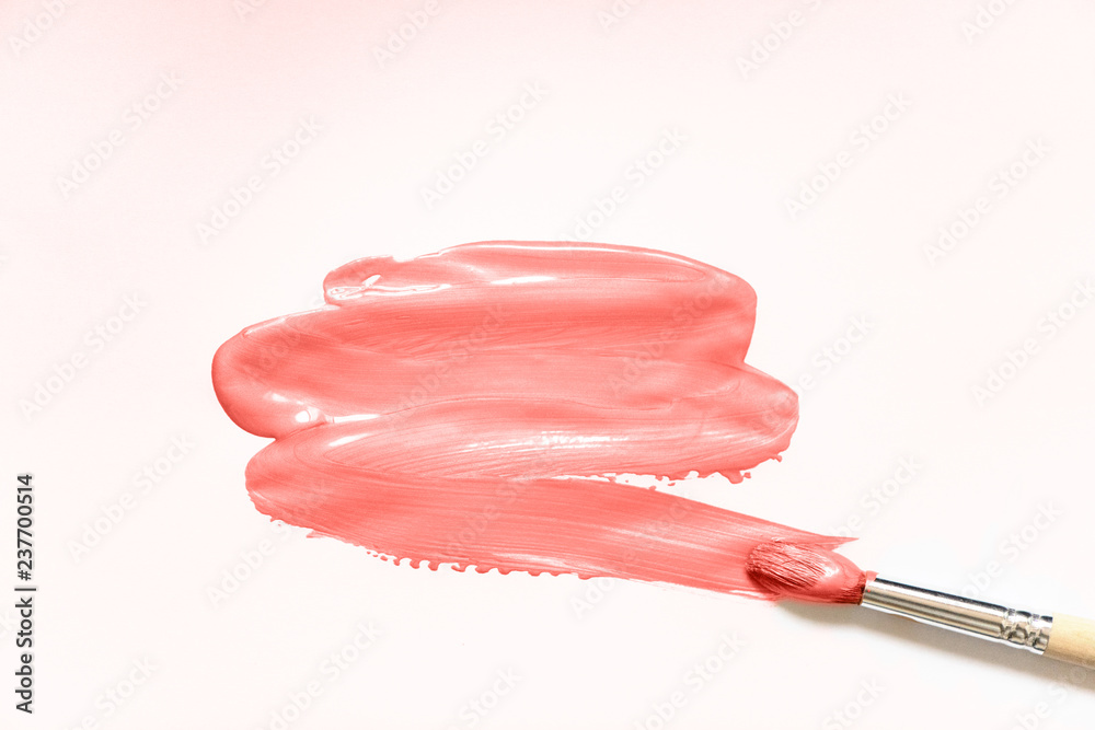 Living coral paint brush stroke isolated on white background. Pantone ...