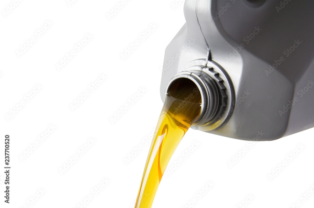 pouring motor oil from silver plastic gallon bottle isolate on white ...