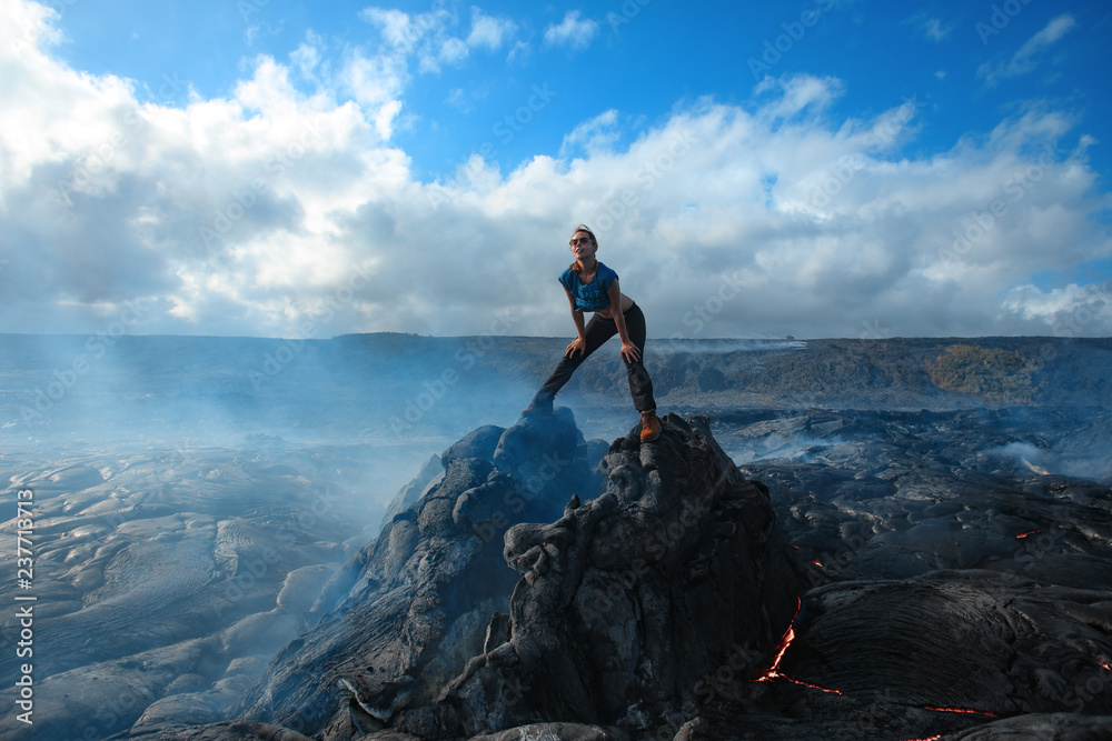 Extremal girl posing at Kilaulea volcano lava field Stock Photo | Adobe ...