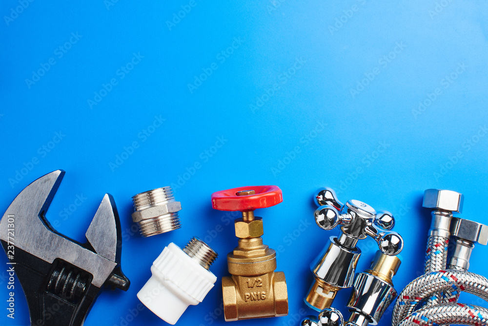 Poster Print plumbing tools and equipment on blue background with copy space 40x26.7 cm