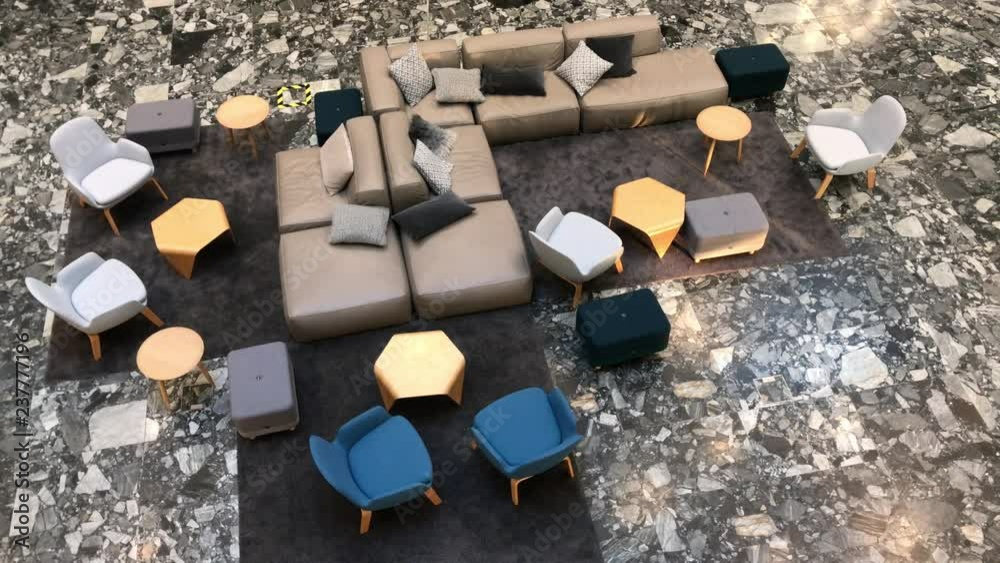 Vídeo do Stock: Few sofas, coloured armchairs, seats and low tables in ...