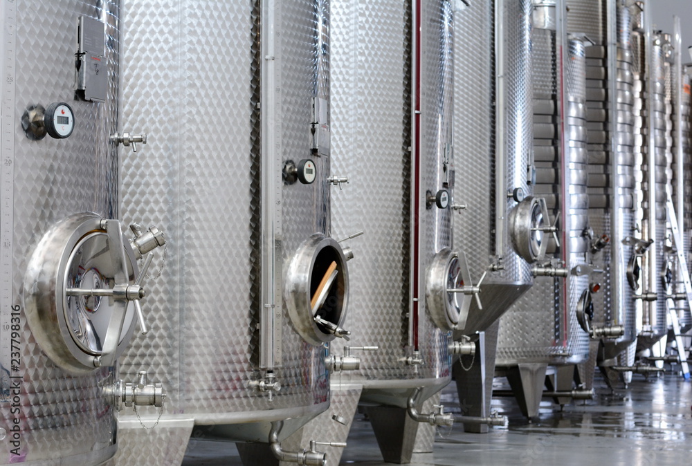Modern wine factory with new large tanks for the fermentation. modern ...