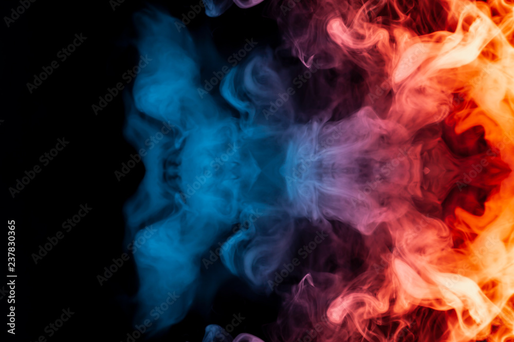 A dynamic explosion of puffs of smoke of light blue orange and red ...
