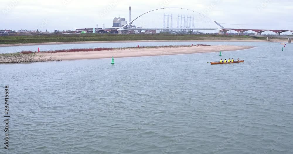 A close drone footage of a rowing competition in the Netherlands ...