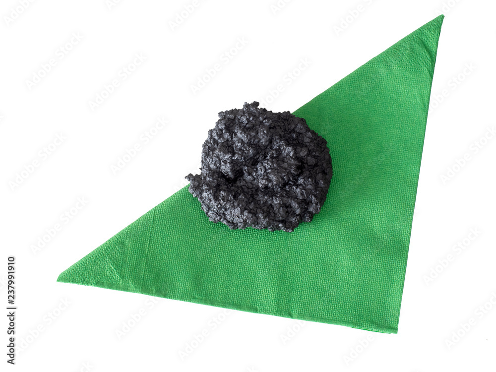 Burned, burnt biscuit. Charcoaled to a crisp Baking failure, with green ...