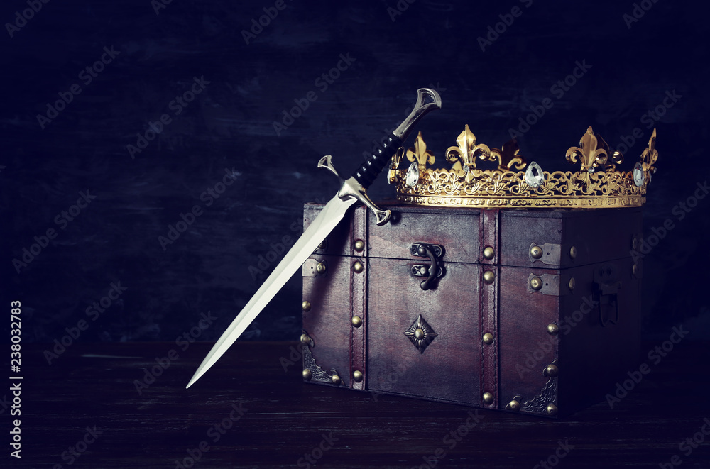 low key image of beautiful queen/king crown and sword. fantasy medieval ...